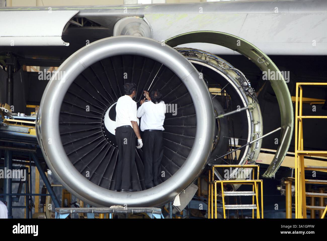 Engineers working on Boeing 747-400 parked for maintenance and repair ...