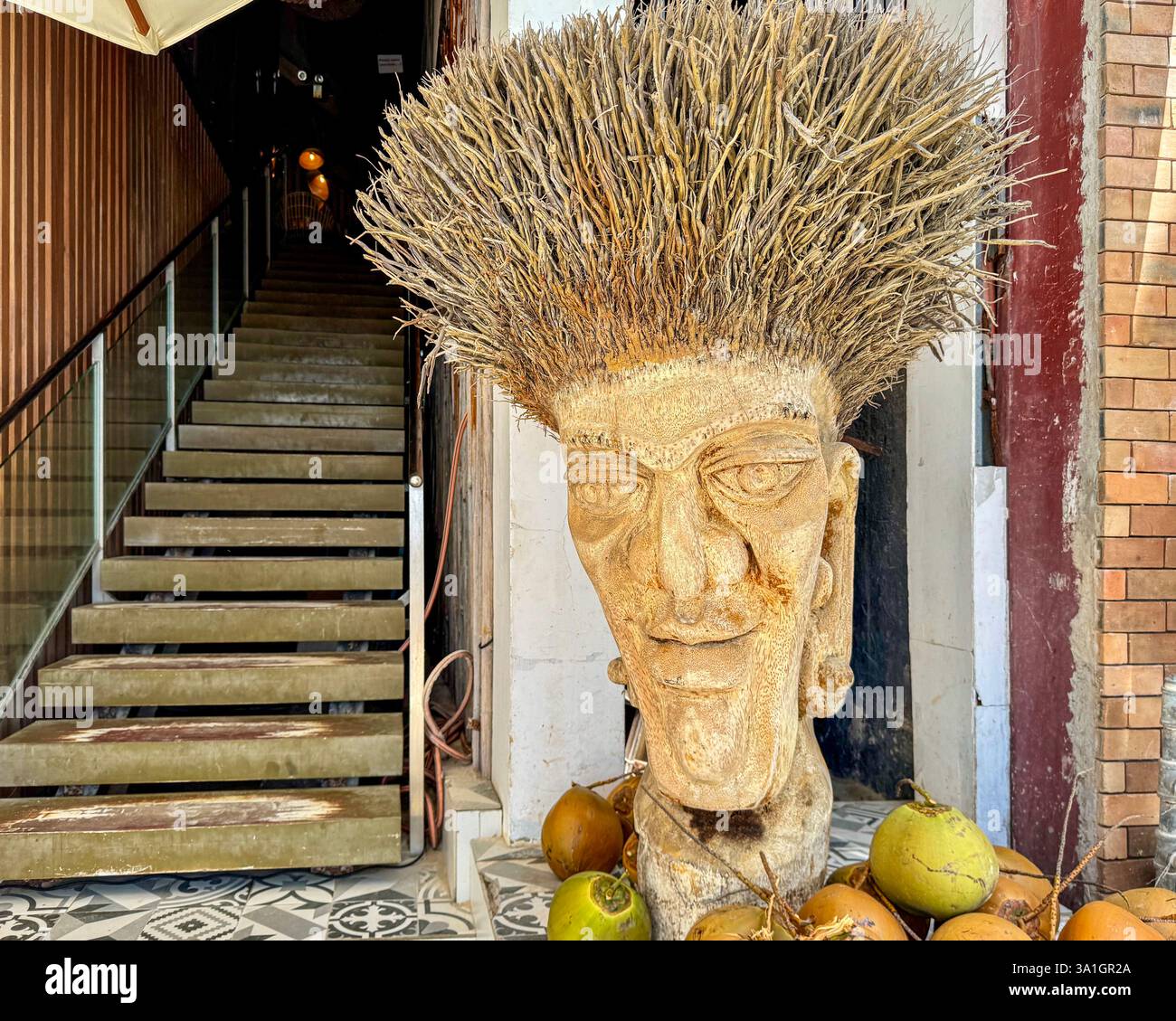 Unique Wooden Sculpture with Straw Hair Stock Photo - Alamy