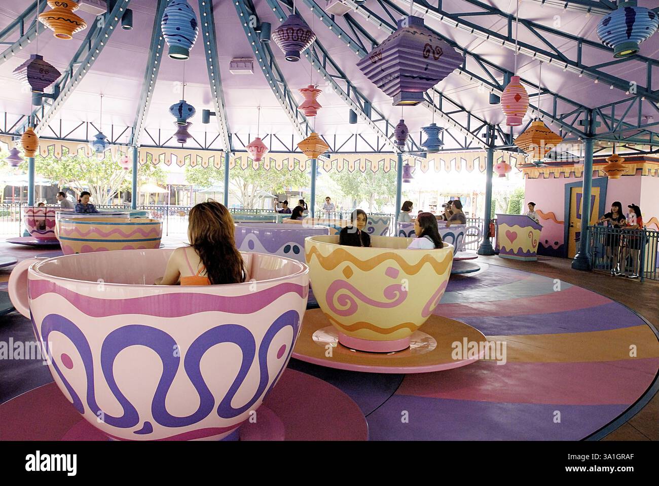 People riding in mad hatter's tea cups at Hong Kong Disneyland, Hong ...