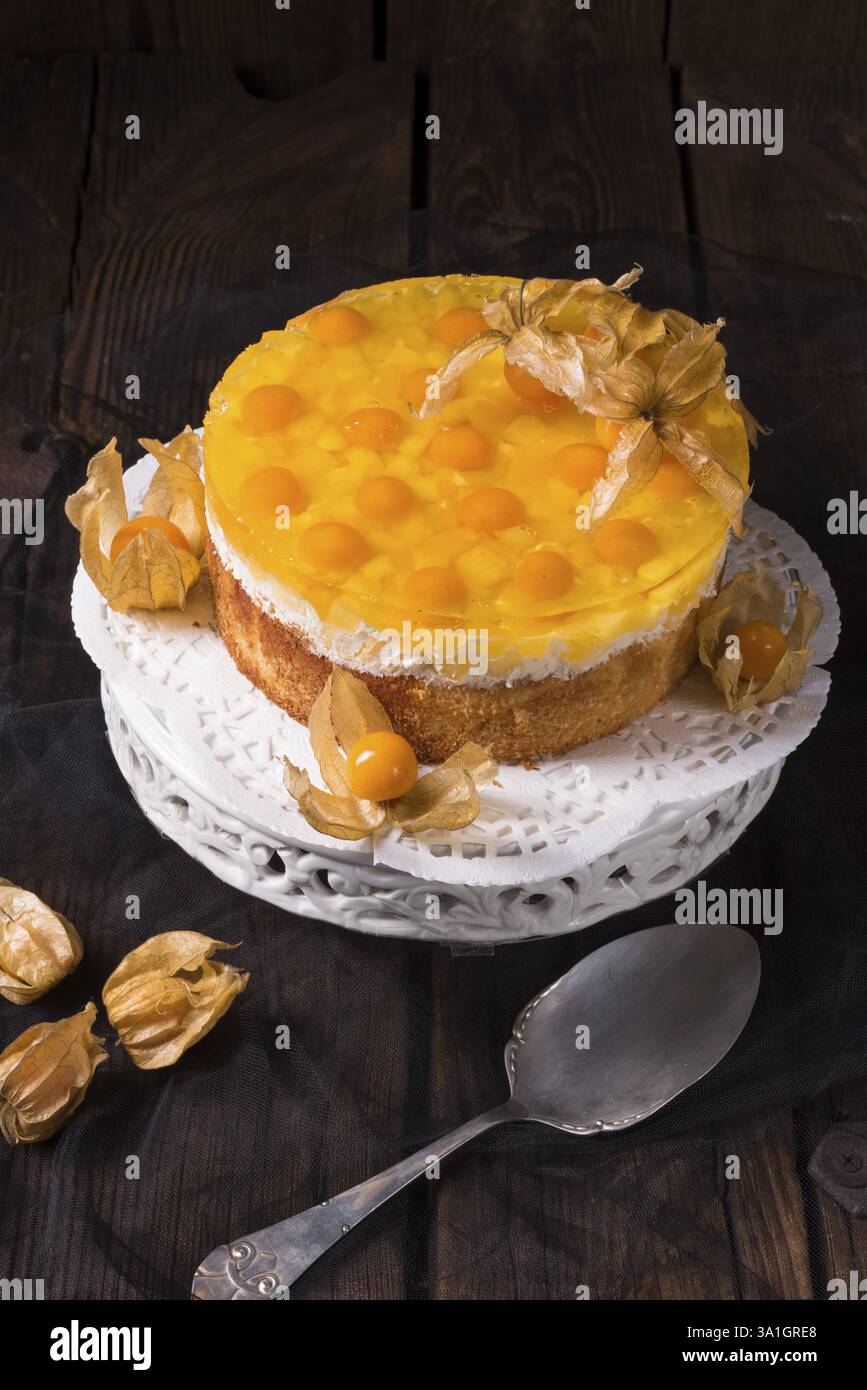 Delicious cakes with physalis, fresh apples and cream Stock Photo - Alamy