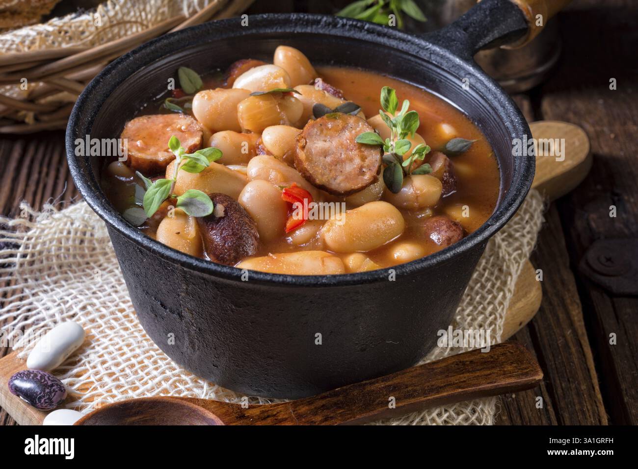 Polish baked beans with sausage Stock Photo - Alamy