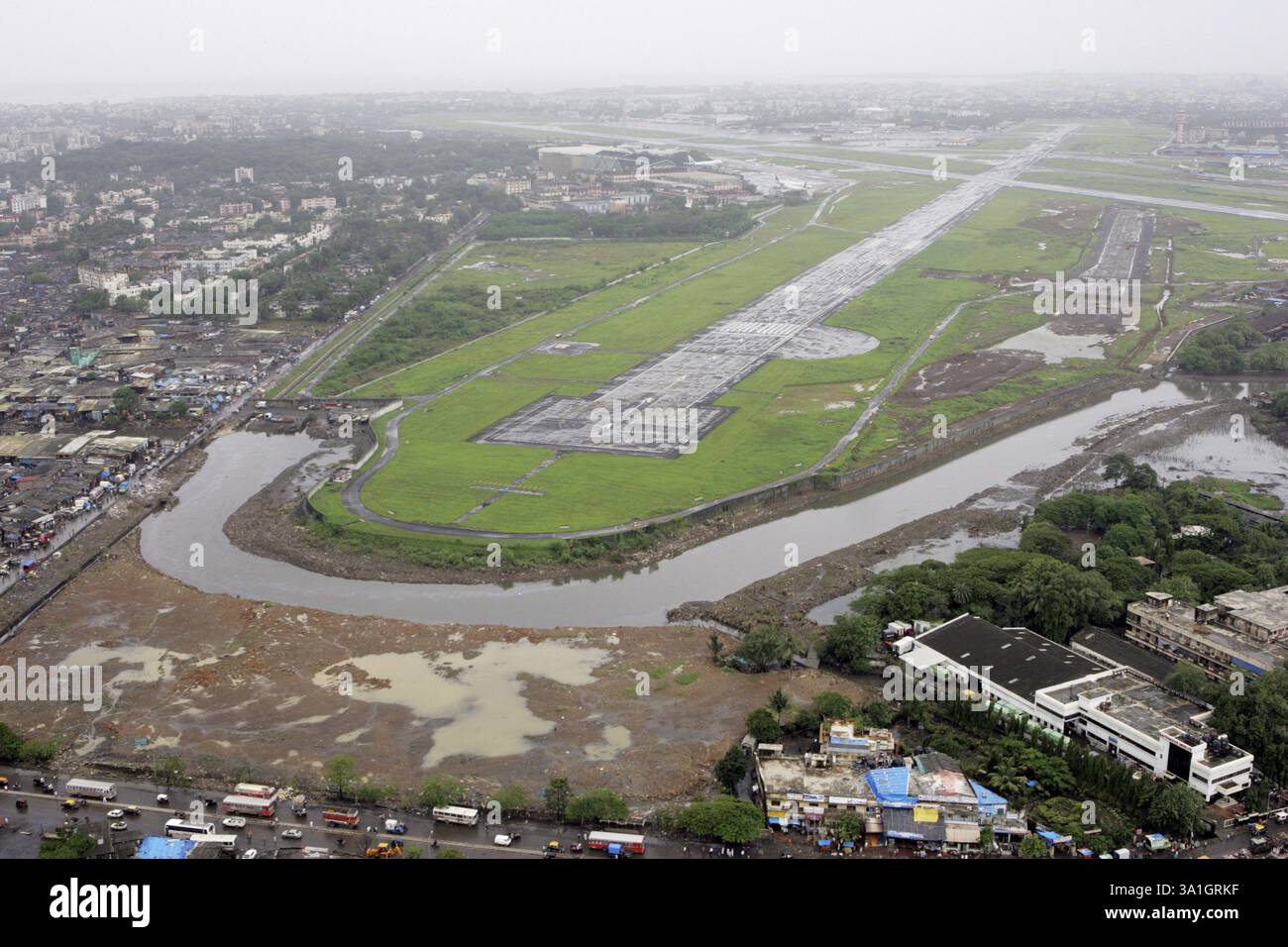 An aerial view of area surroundings runways also Mithi river flowing ...