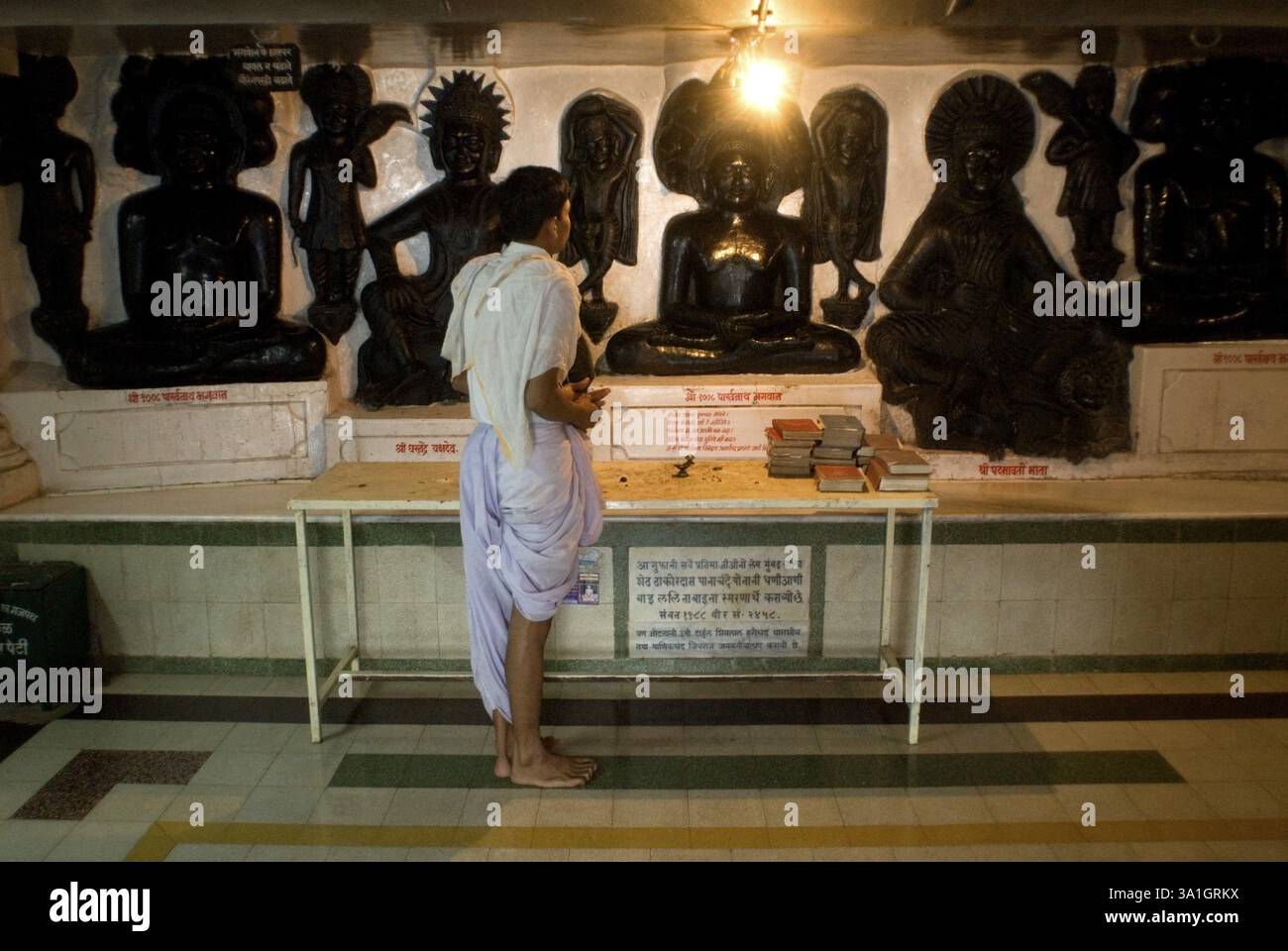 Priest standing in Gajadhwaja Hillock temple, Chamar Leni, Nashik ...