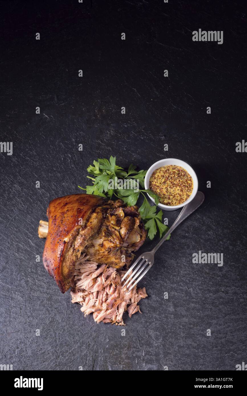 Fresh roasted knuckle of pork with mustard Stock Photo - Alamy