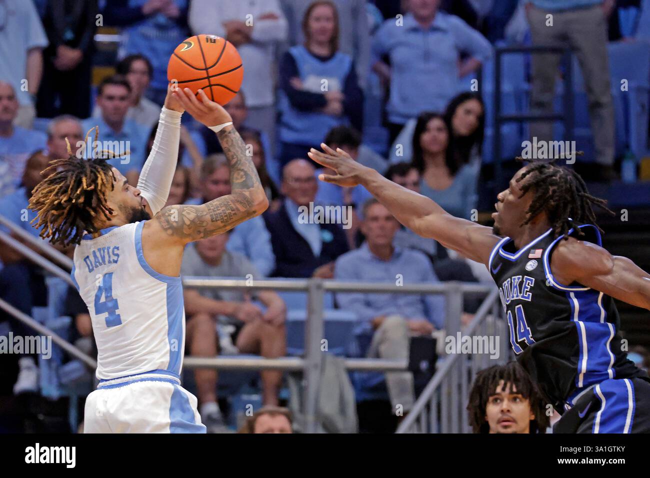 North Carolina guard RJ Davis (4) shoots over Duke guard Sion James (14 ...