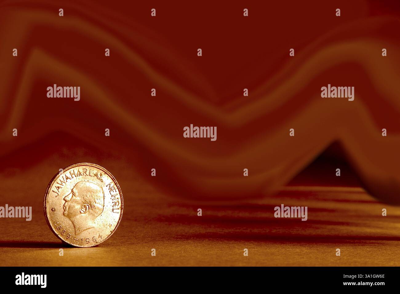 One single Indian currency one rupees coin and artistic background ...