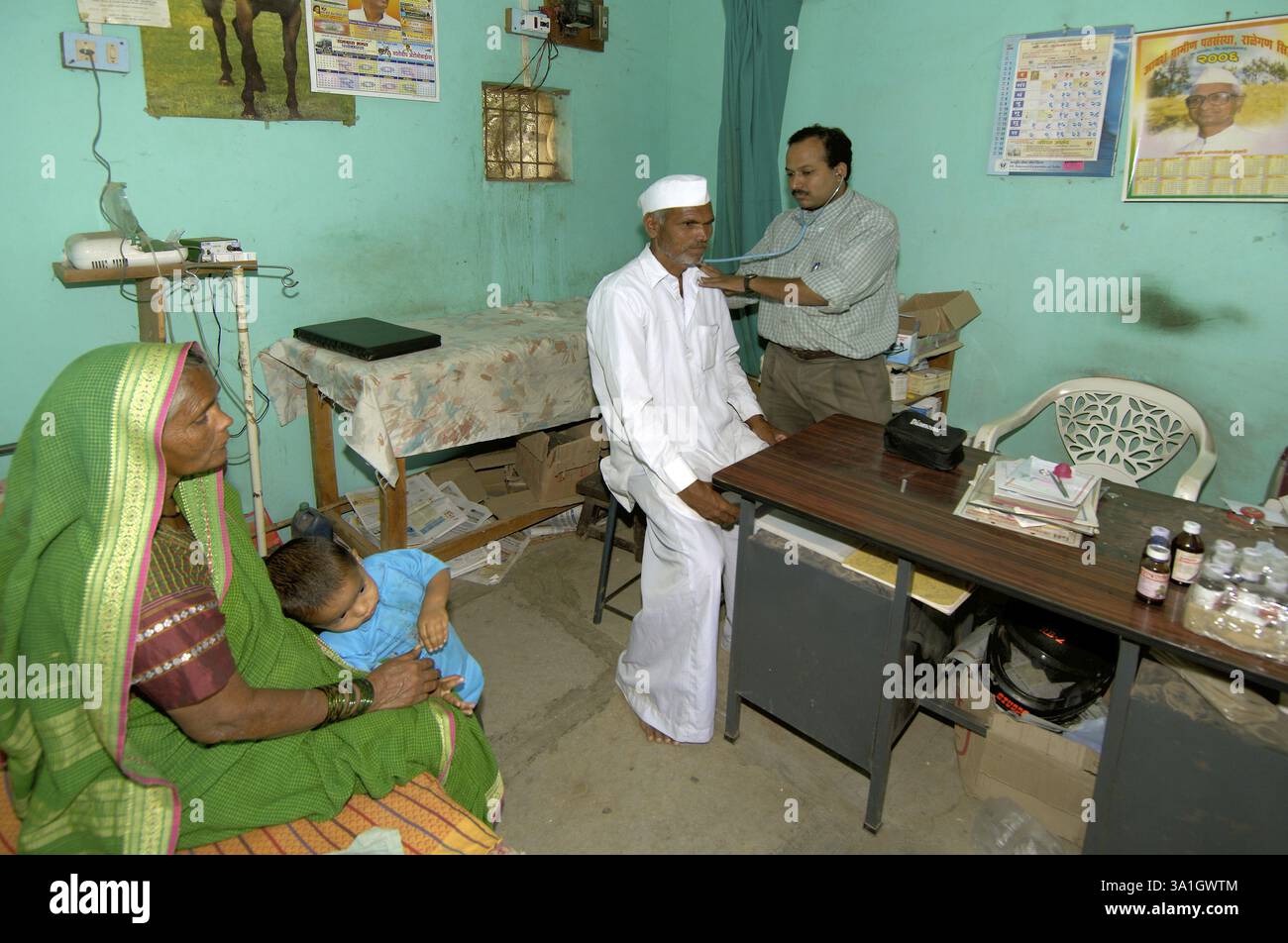 Doctor examining villagers at private clinic at Ralegan Siddhi near ...