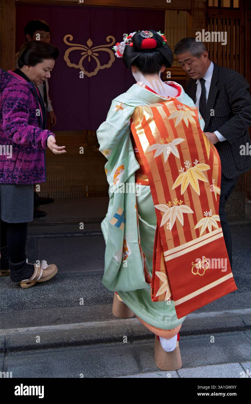 A Japanese maiko, or apprentice geisha or geiko, at an okiya teahouse ...