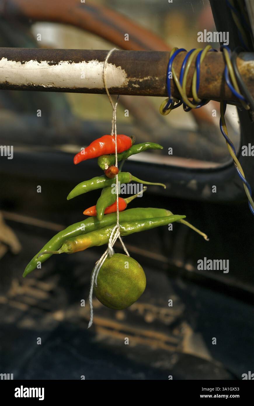 Nimbu mirchi aka lemon and chilli tied on bar common superstition to ...