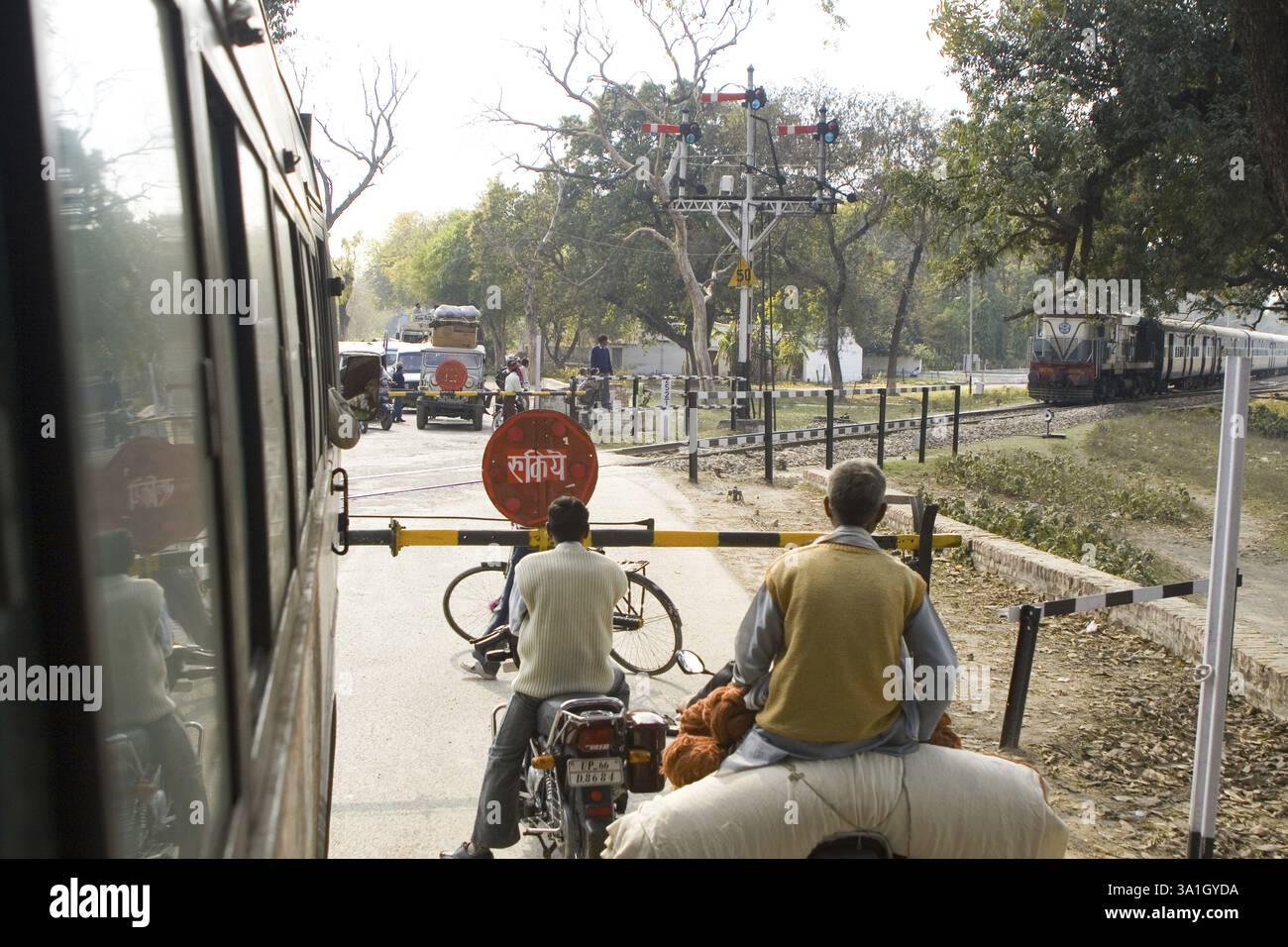 Crossing on railway track showing stop board, India, Asia Stock Photo ...