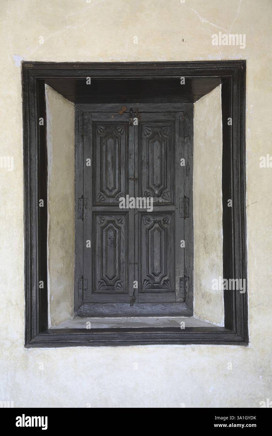Closed window and window frame in think wall of Padmanabhapuram Wood ...
