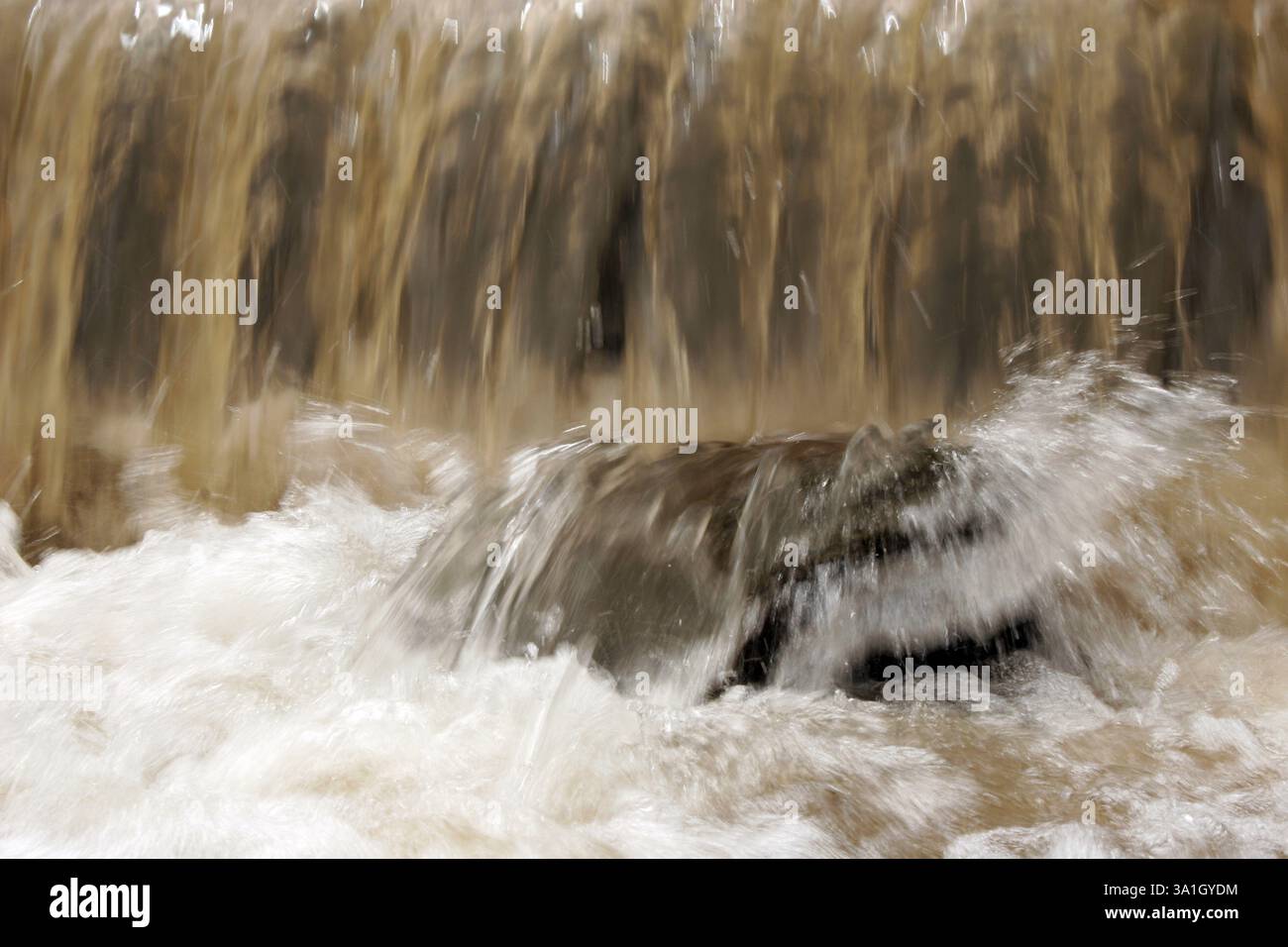 Abstract of the waterfall formed with the rapid flow of the river Shiv ...
