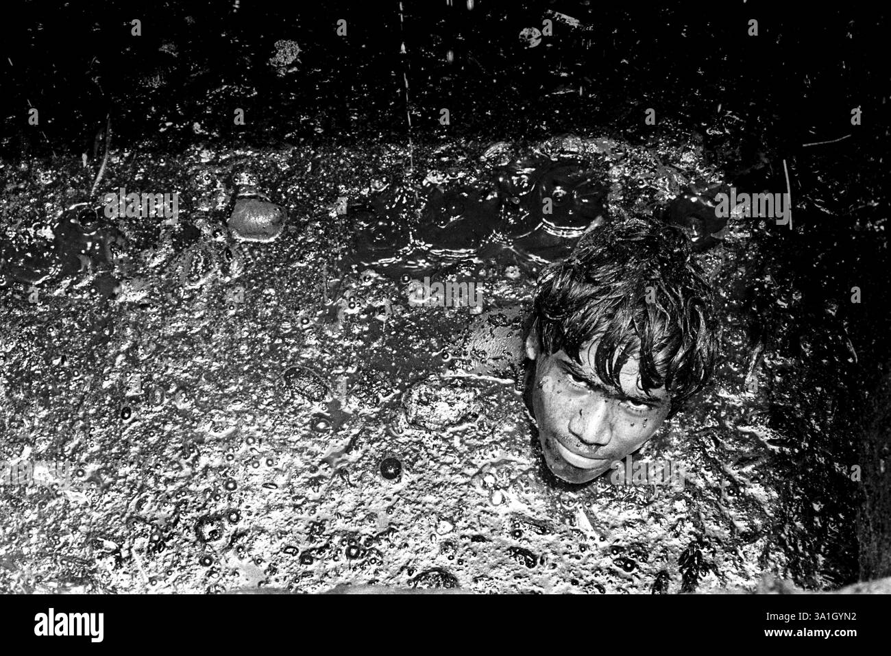 Boy in drainage Stock Photo - Alamy