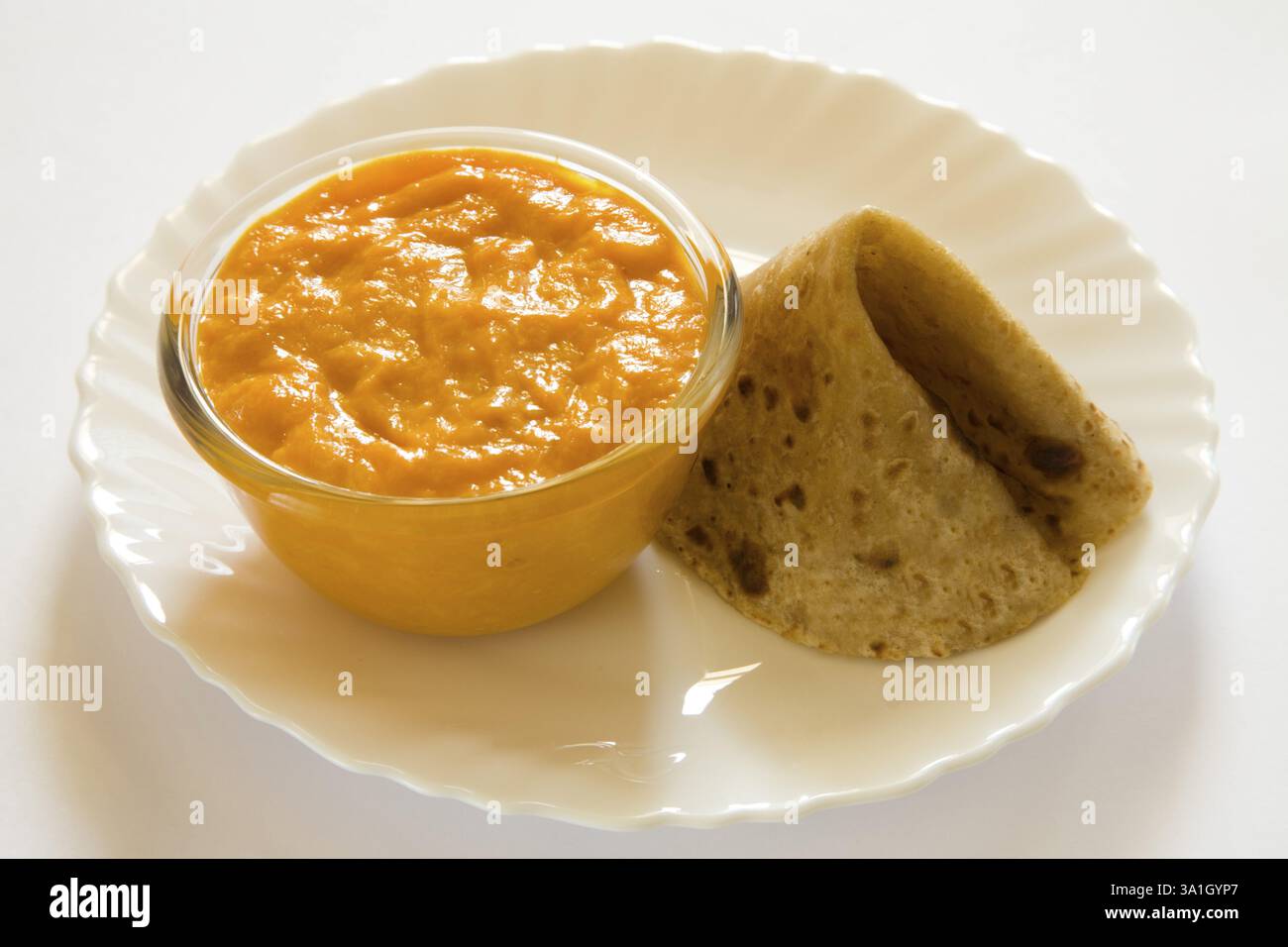 Indian fruit mango pulp with paratha Indian bread served in bowls and ...