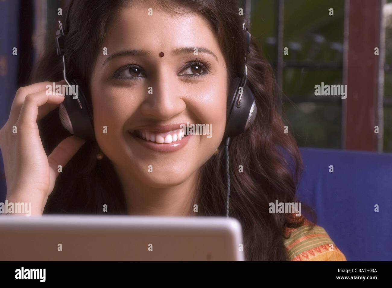 Medha operating laptop, India MR# 690D Stock Photo - Alamy