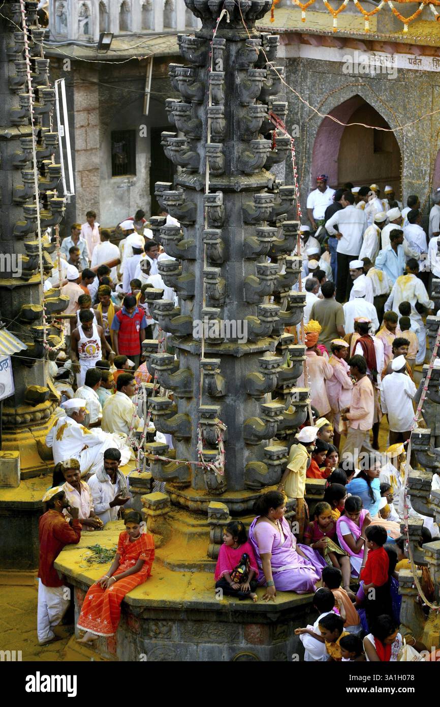 Devotees seated at the Deep Mala that is light stands of stones in the ...