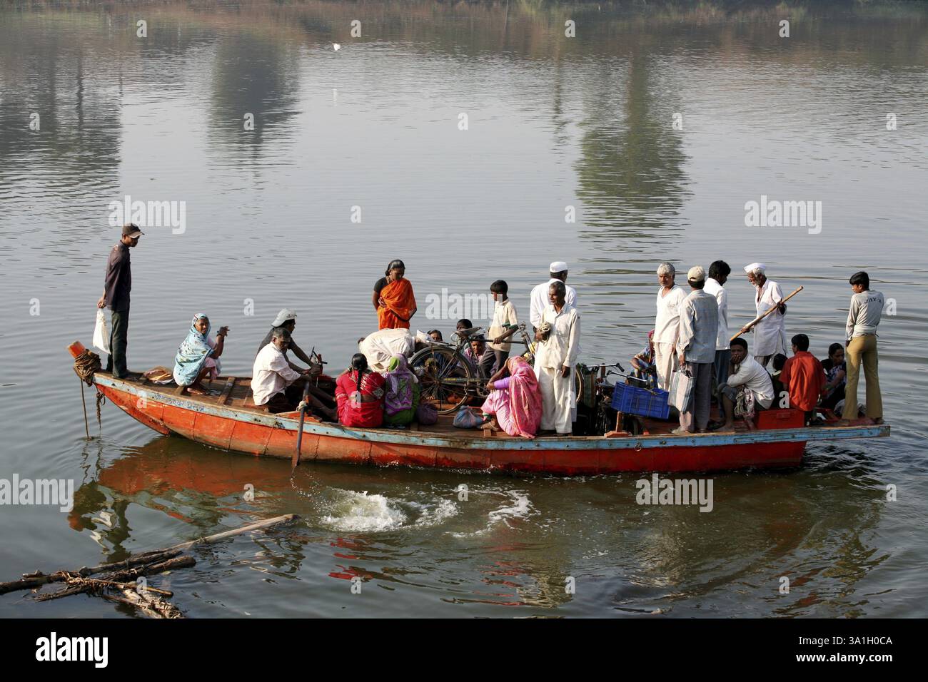 Villagers of the Haripur village loading their bicycles on a boat ...