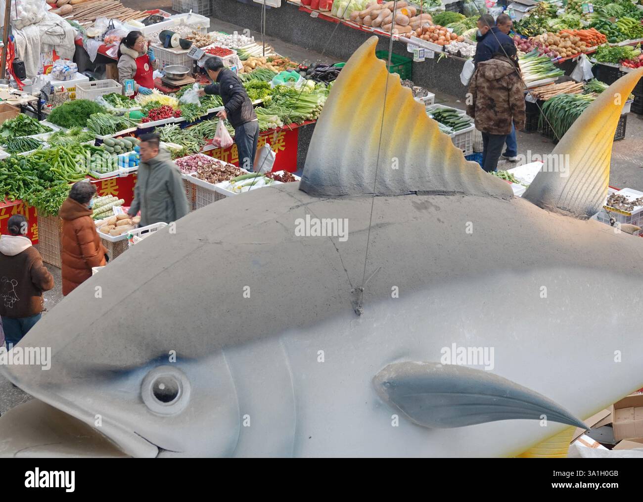 YANTAI, CHINA - MARCH 9, 2025 - Consumers buy vegetables at a farmer's ...