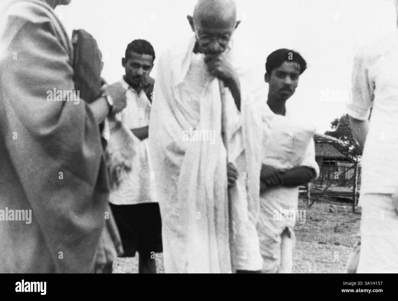 Mahatma Gandhi walking with Dhirendra Chatterjee (brother of Abha ...