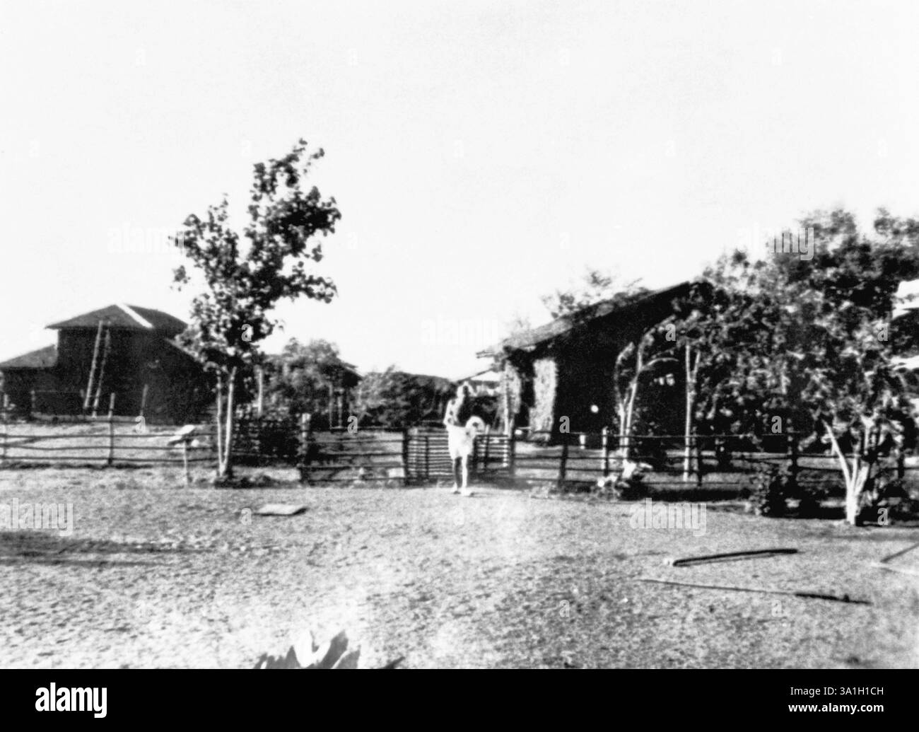 Mahatma Gandhi walking in front of his hut at Sevagram Ashram, 1941 NO ...