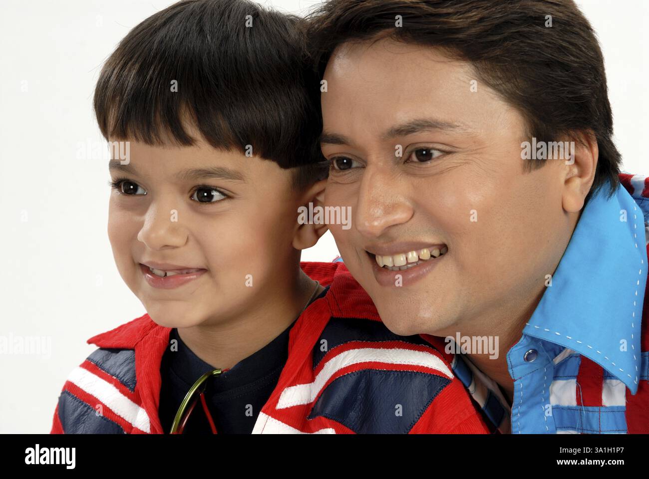 South Asian Indian father and son smiling and enjoying, Bombay Mumbai ...