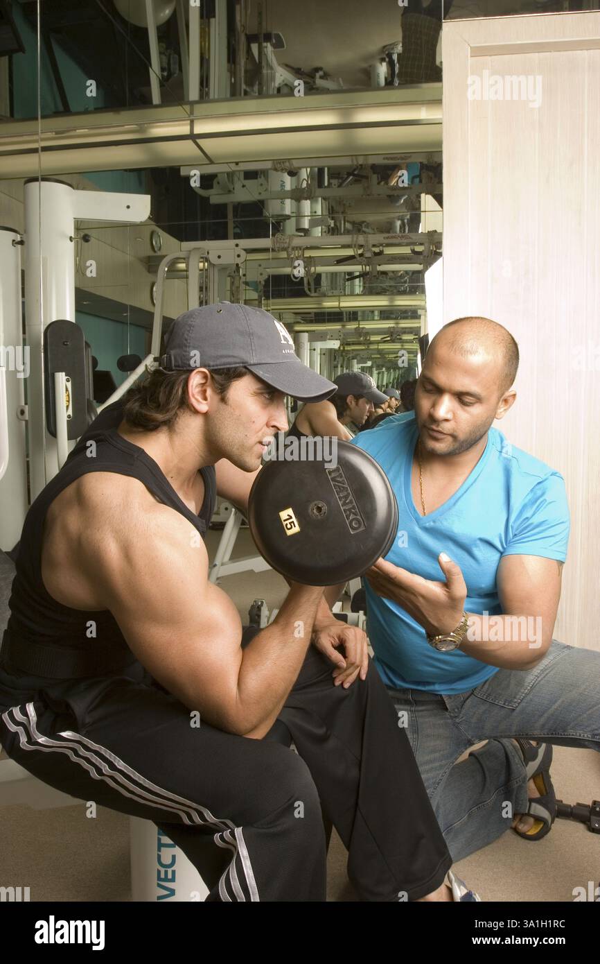 Bollywood Hindi film actor Hrithik Roshan with gym trainer Satya NO MR ...