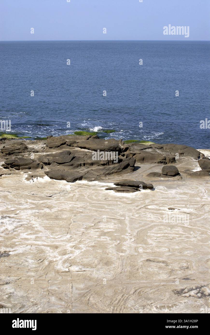 A splendid design made by sea waves on igneous rocks of lava from ...