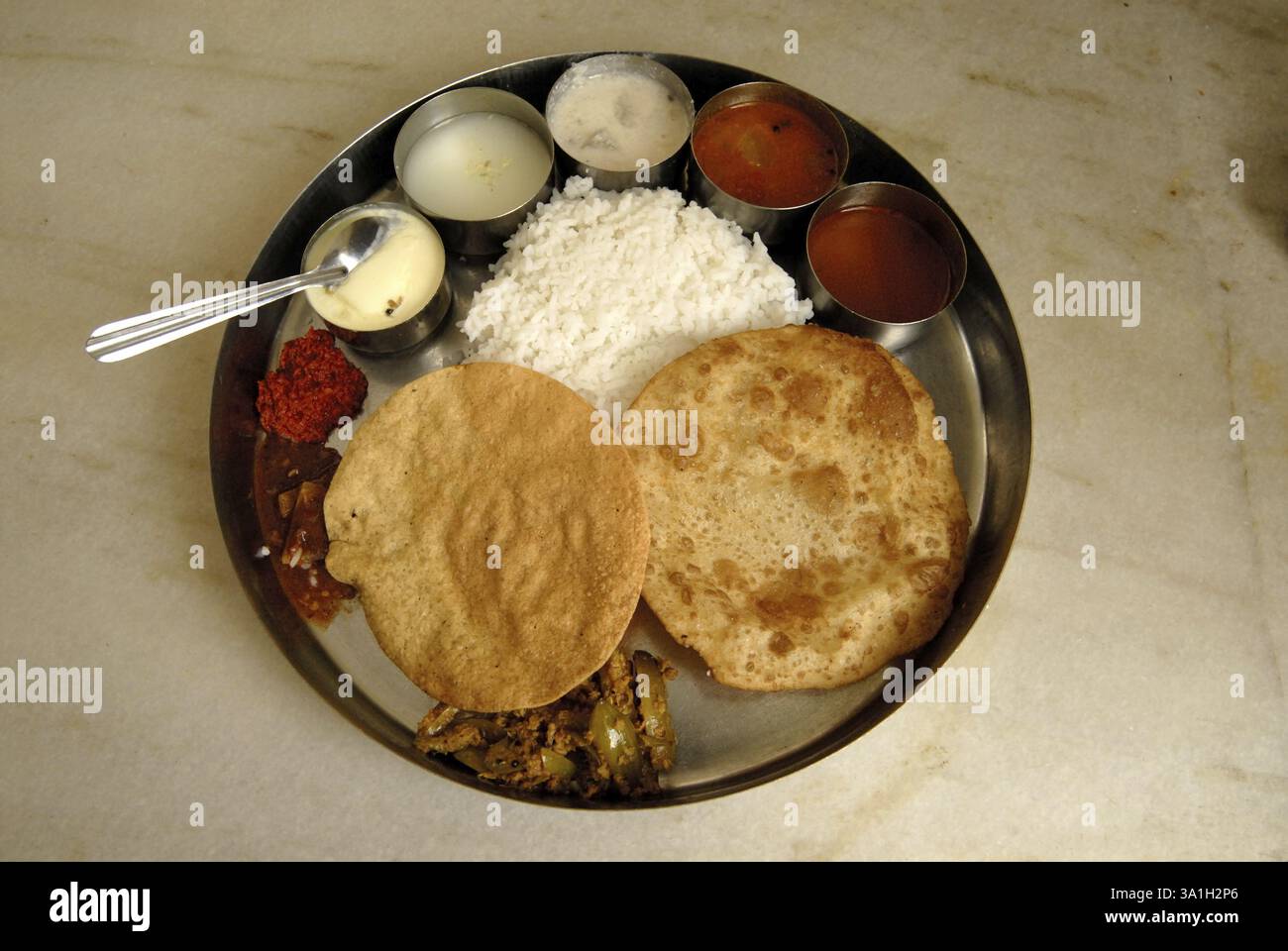 Puri, plain rice, two vegetables, rassam, curd, butter milk, dry chatni ...