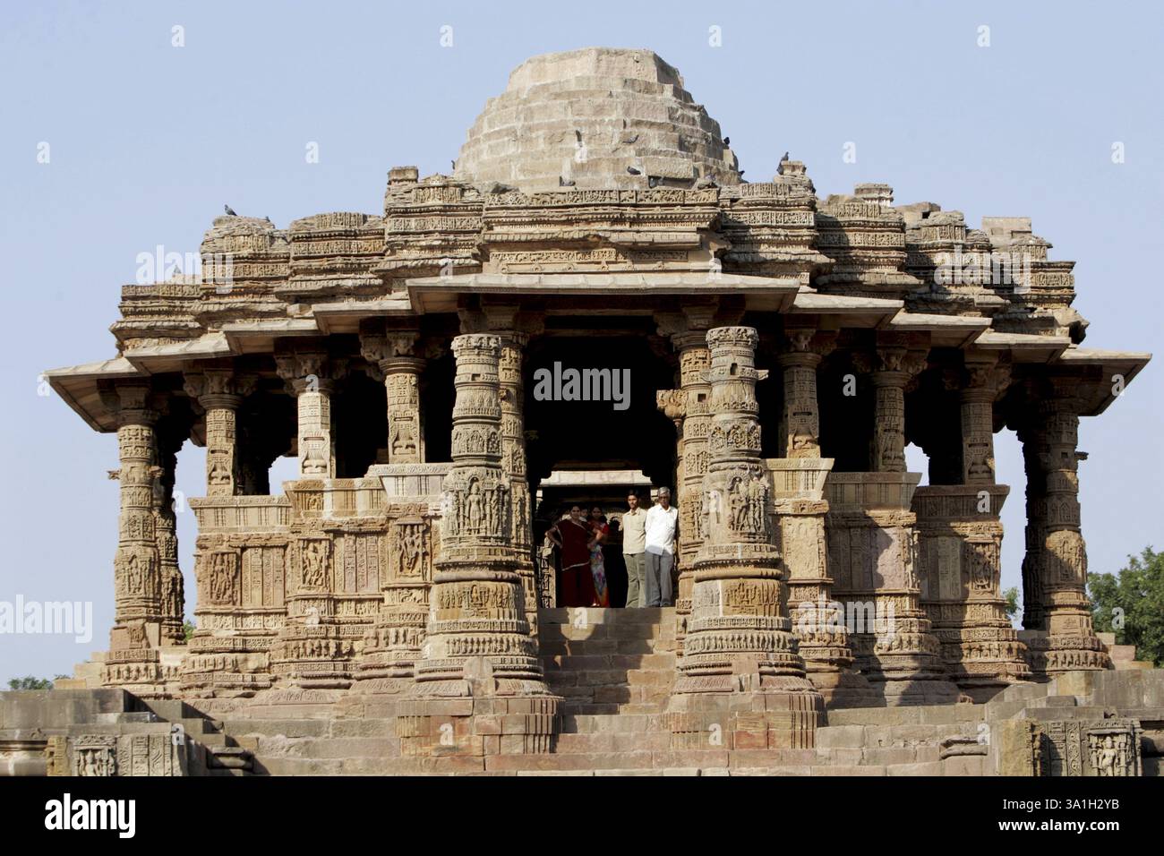 Tourists at the Modhera Sun temple (1026 A.D.) situated at a distance ...