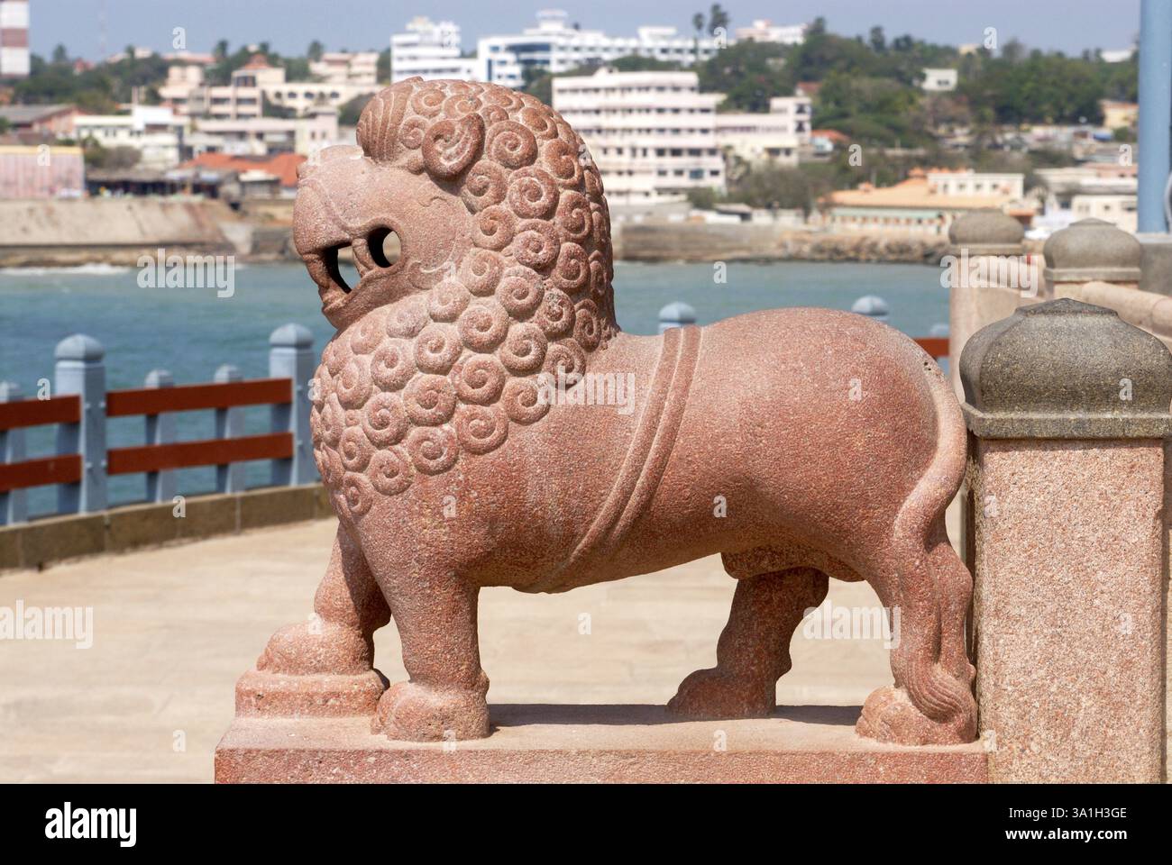 Red stone carved lion at the entrance of Shripada Mandapam at ...