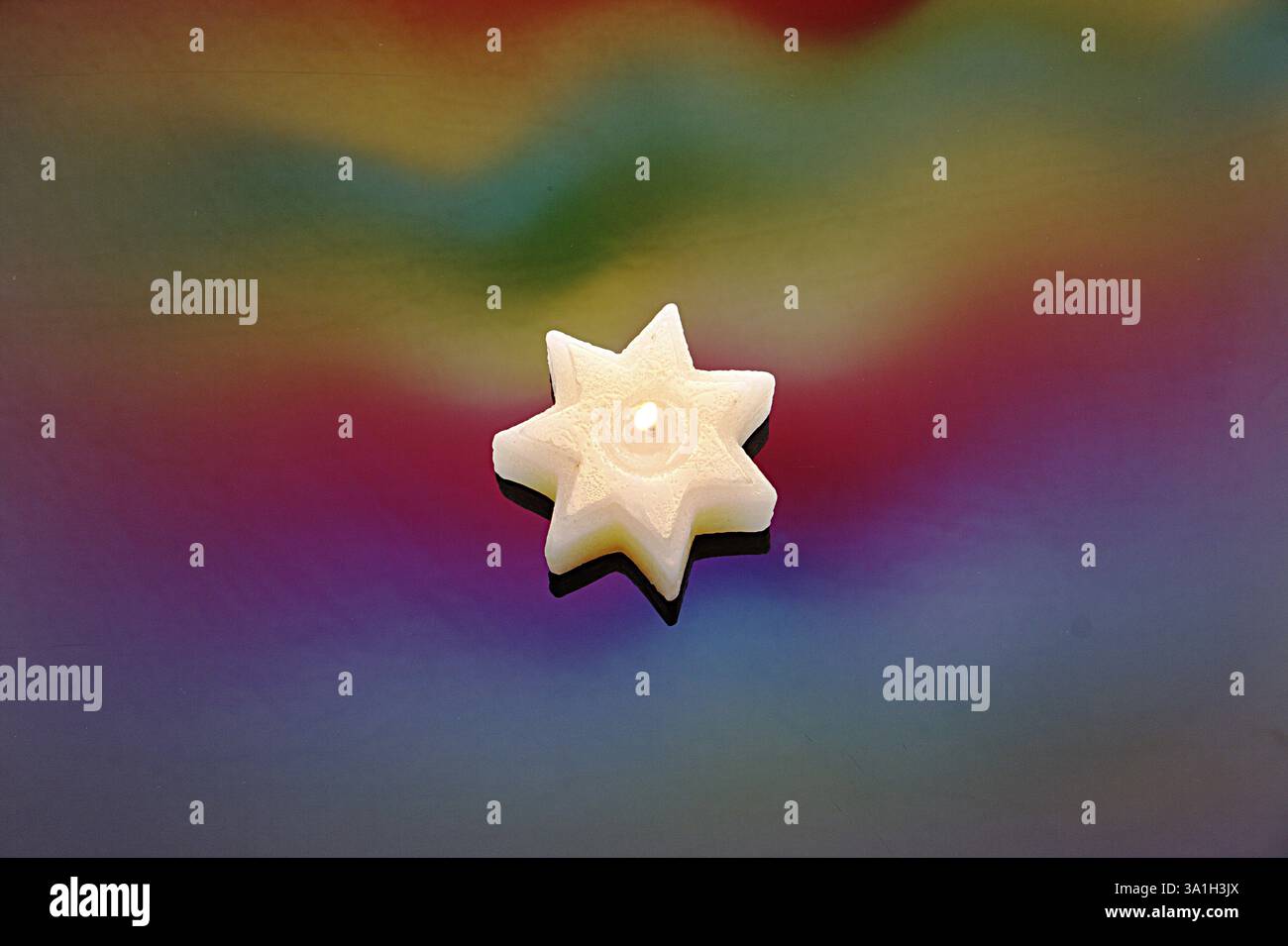 STAR Candle symbol of hope on Rainbow background Stock Photo - Alamy