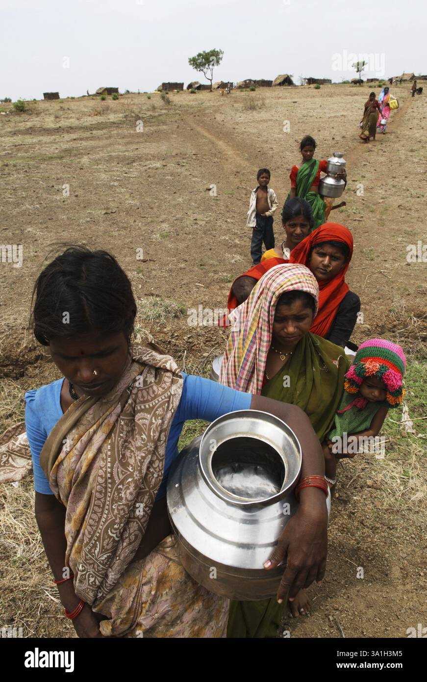 Rural women carrying water pots, water scarcity and migration in ...