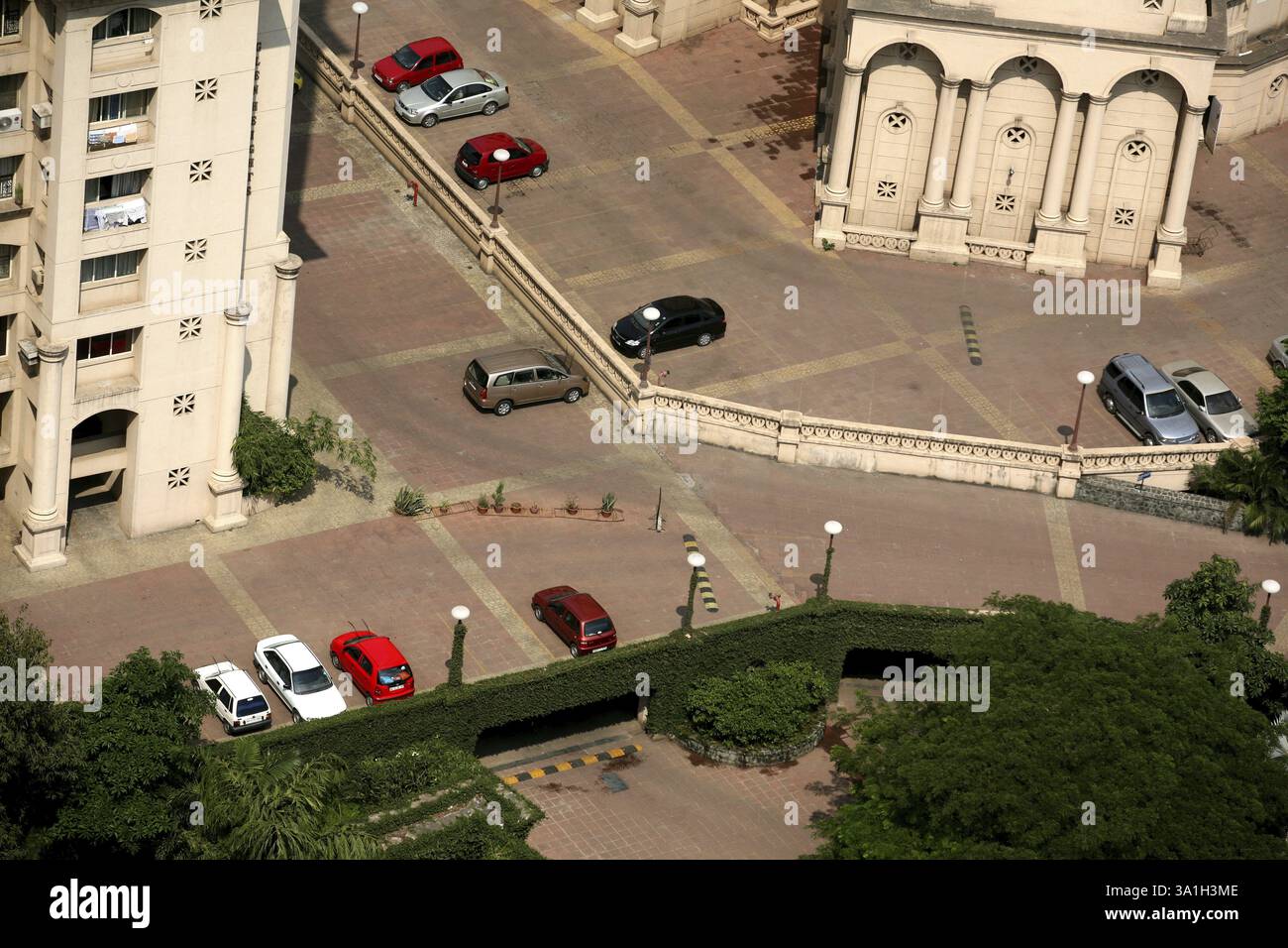 Cars parked in parking lot of high rise situated at Hiranandani in ...