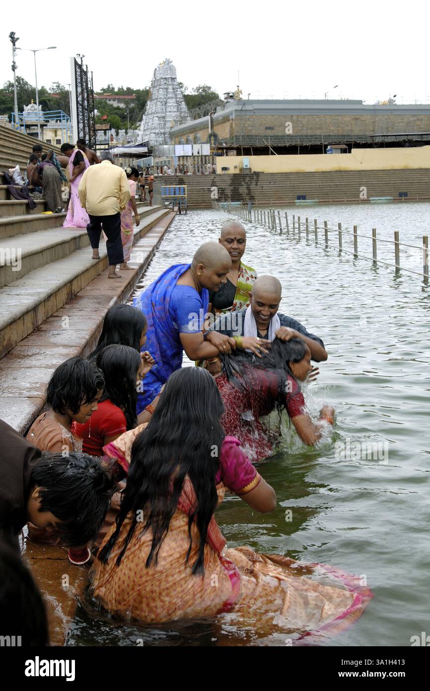 Devotees bathing the sacred tank (Pushkarini) at Tirumalai, Tirupati ...