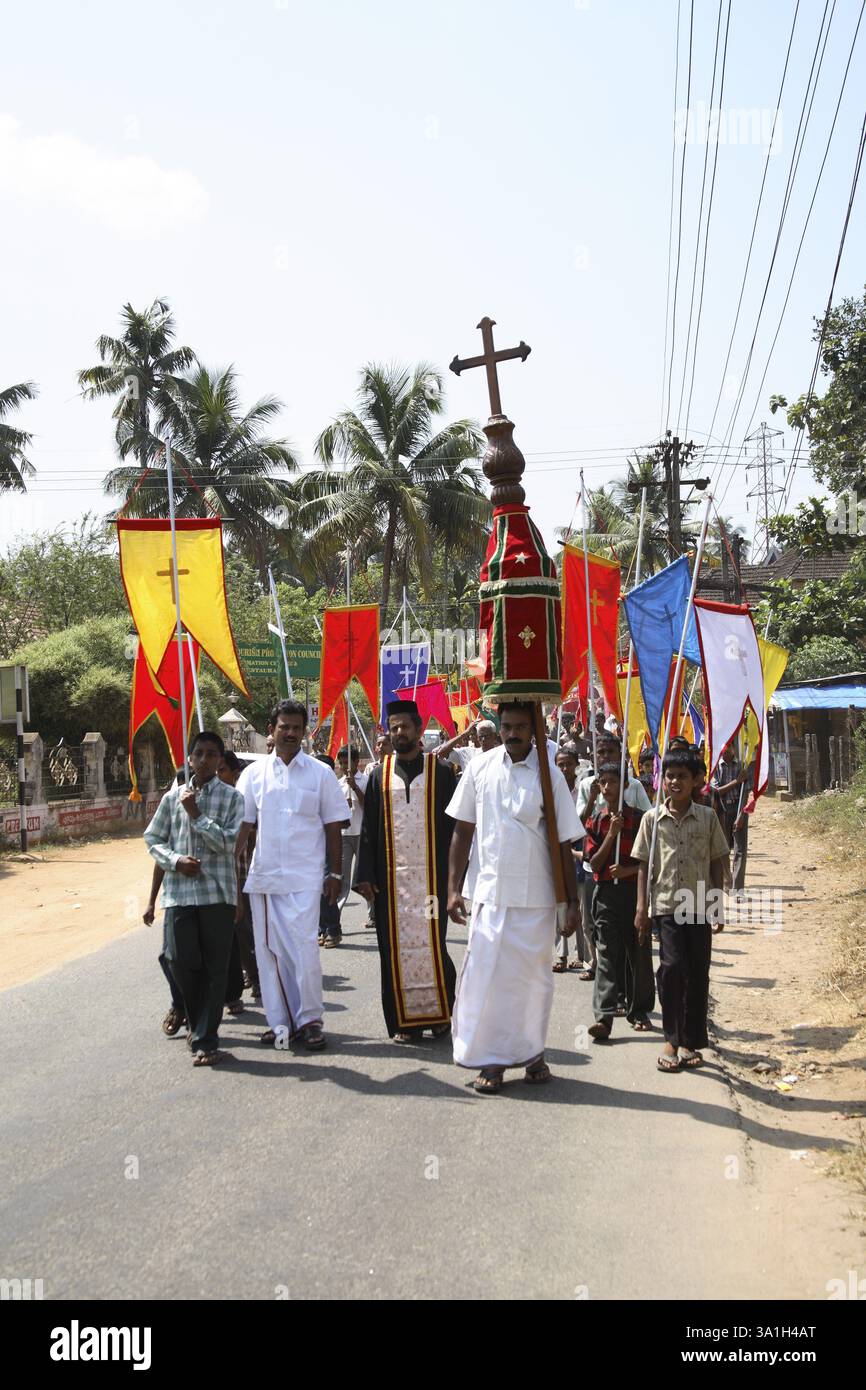Syrian Christian starting of procession man with main cross priest and ...