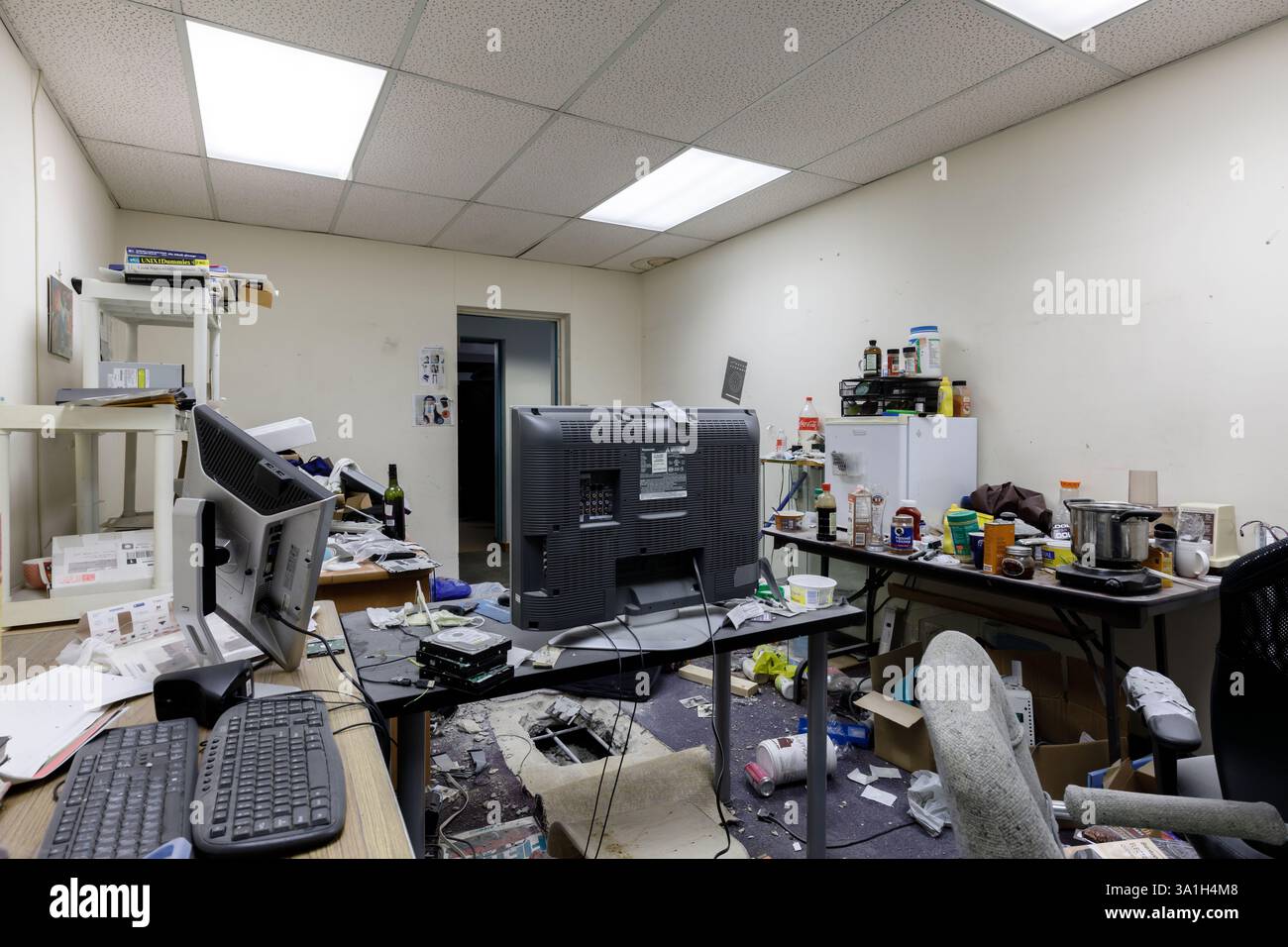 A very messy office in an abandoned office building. This building has ...