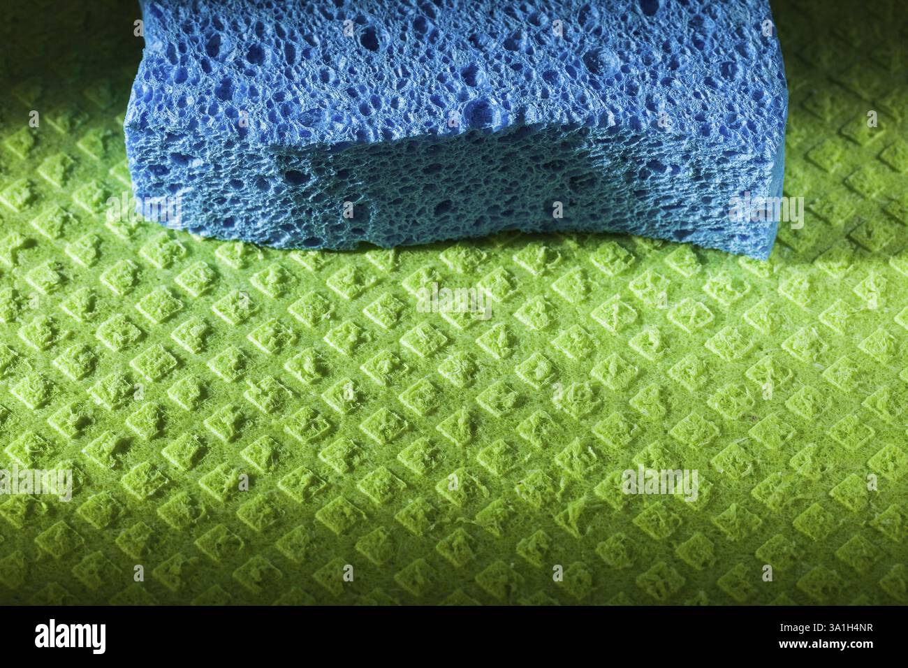 New blue sponge on washcloth Stock Photo - Alamy