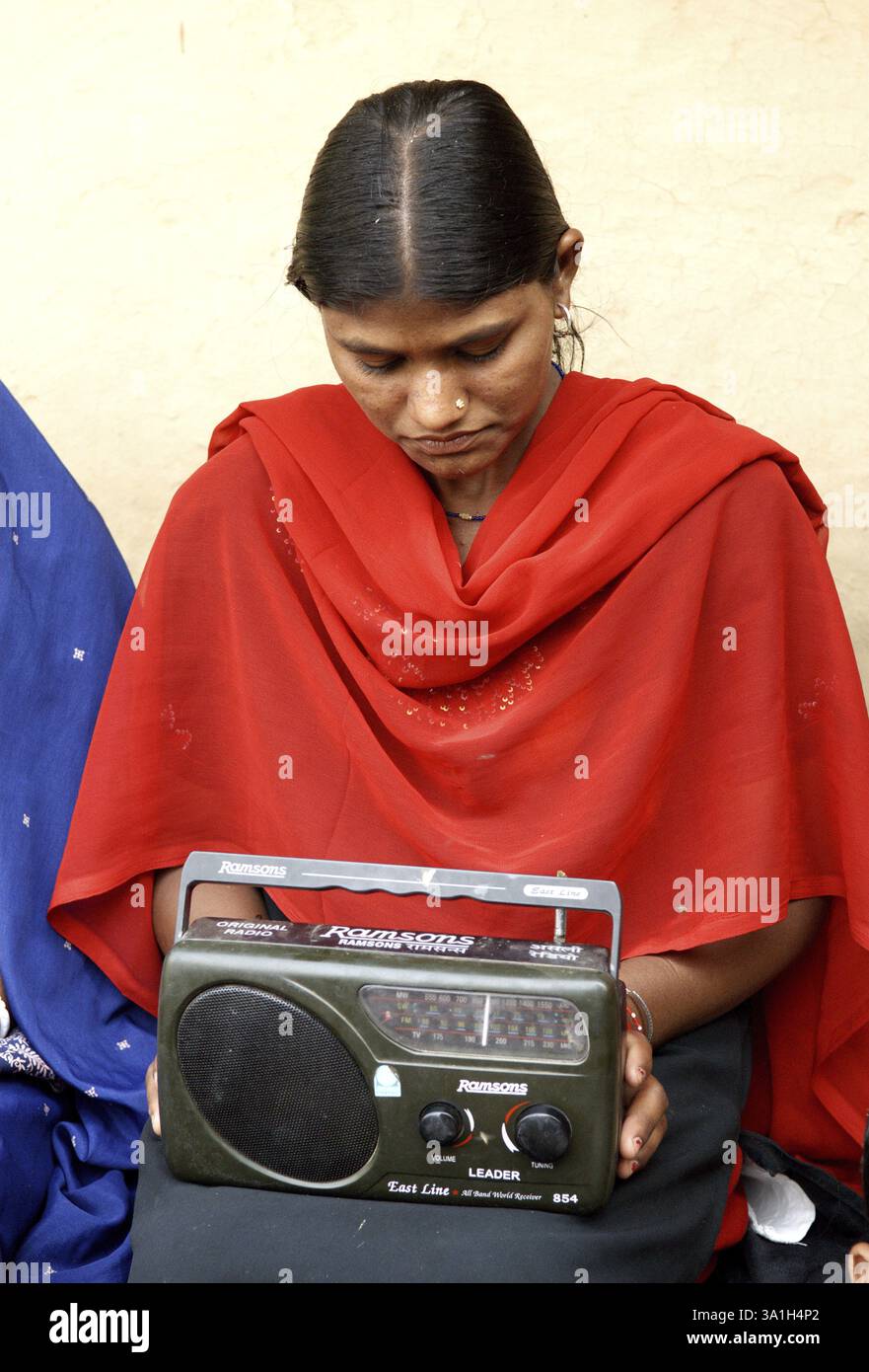 Woman listening radio, NGO Alternative for India Development (AID ...