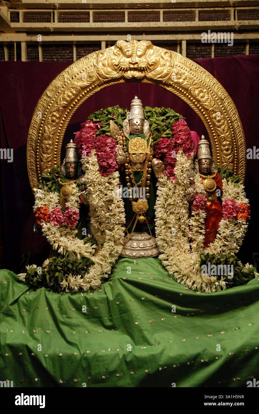Decorated Urchava deity of lord Subrahmanya with consorts Valli and ...