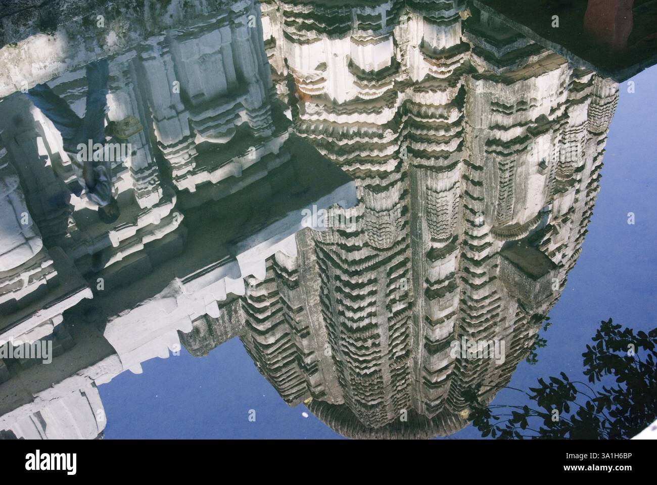 Reflection of 11th century Brahmeshwar temple in ritual pond dedicated ...