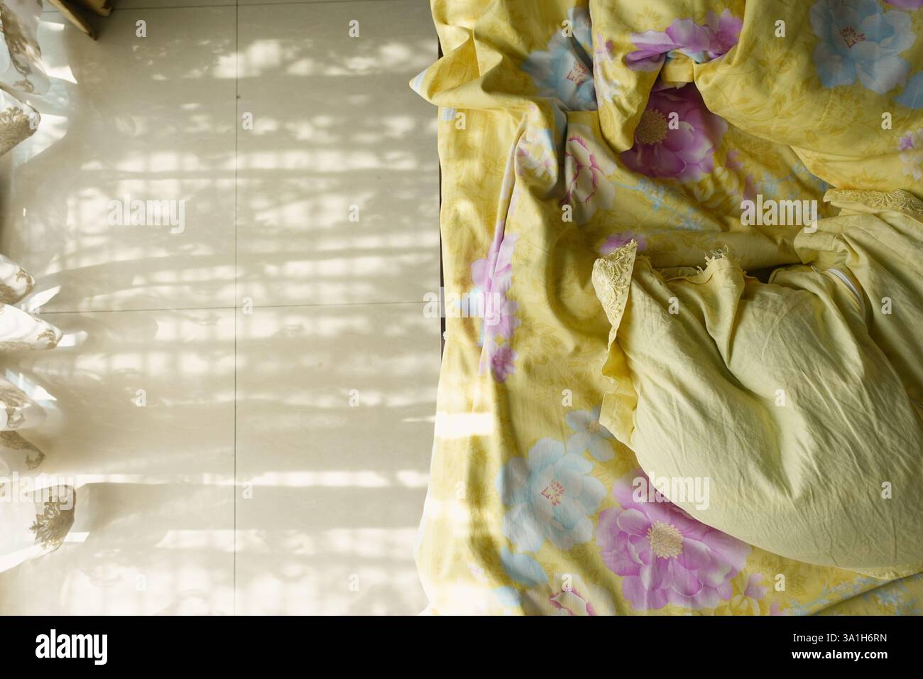 top view of Messy bed with clothes at early morning Stock Photo - Alamy