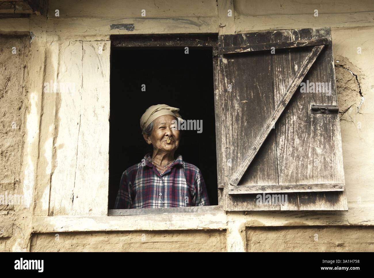 Rural old woman standing in window, Pastanga, Sikkim, India, Asia Stock ...