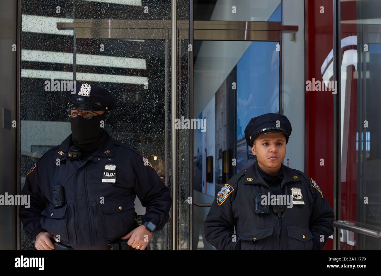 New York, New York, USA. 8th Mar, 2025. Two NYPD officers protect the ...