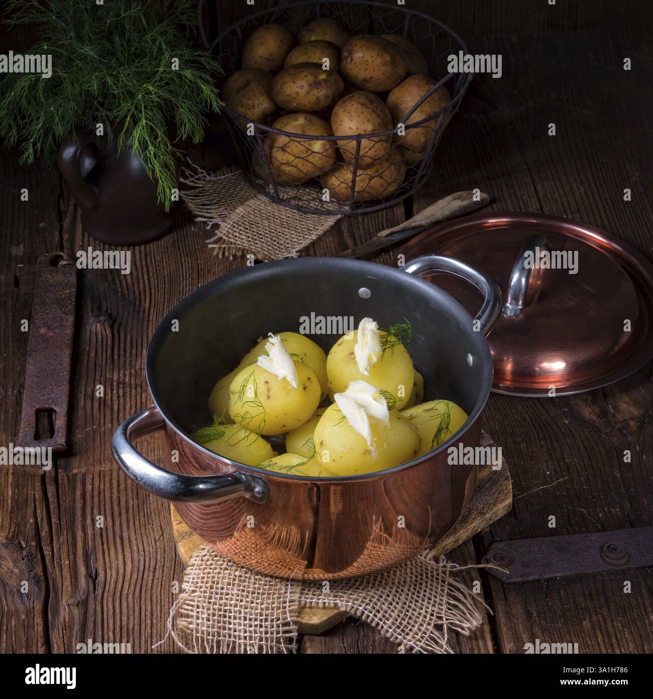 Fresh boiled young potatoes with butter Stock Photo - Alamy