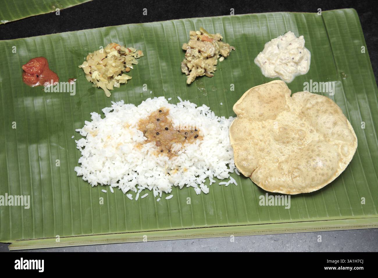 South Indian food served on banana leaf cabbage and mixed vegetable ...