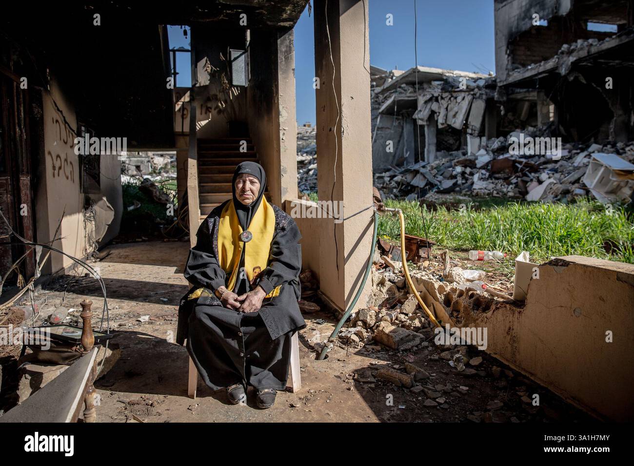 March 1, 2025, Aitaroun, Lebanon: An old woman sits in her partially ...