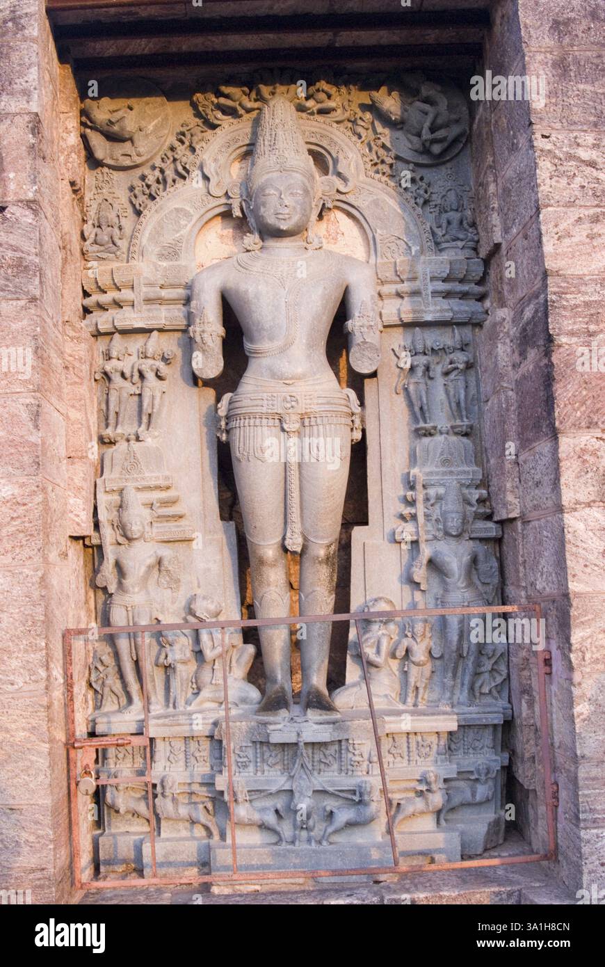 Statue of Vedic Sun god Surya or Arka in mellow mood carved on wall of ...