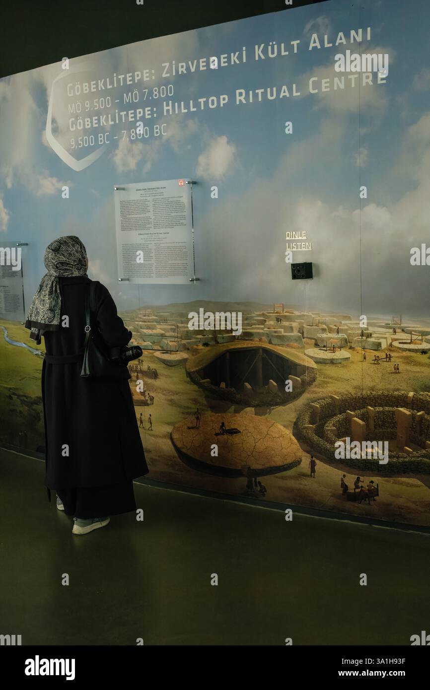 Gobeklitepe, Turkey, Turkiye. Woman Reading Museum Exhibit Information Stock Photo - Alamy