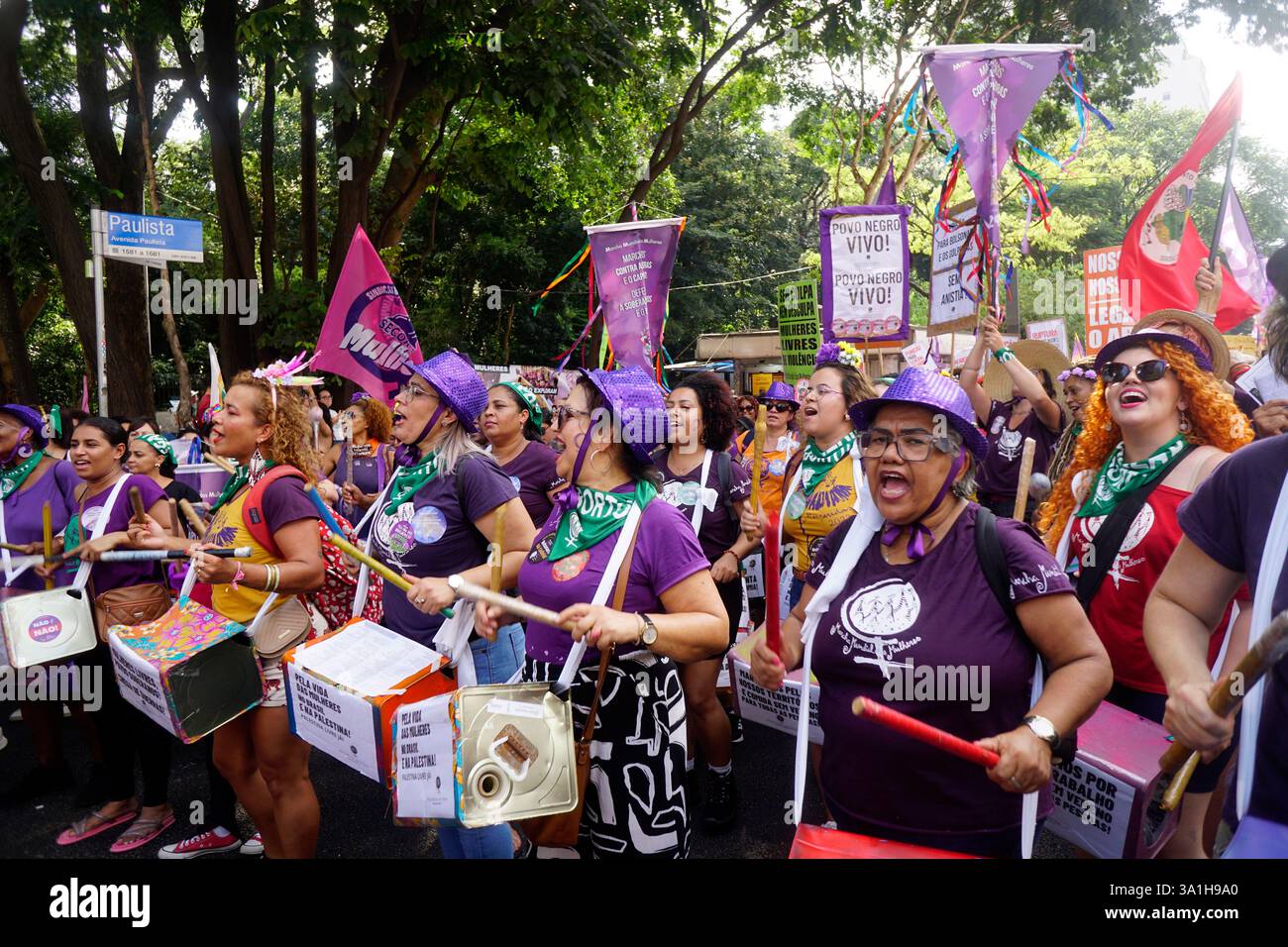 Women take part in a march to mark International Women's Day in Sao Paulo, Brazil March 8, 2025 ...