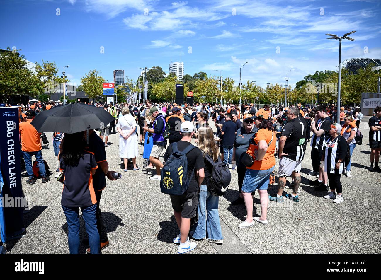 Fans line up outside prior to the commencement of the Opening Round ...